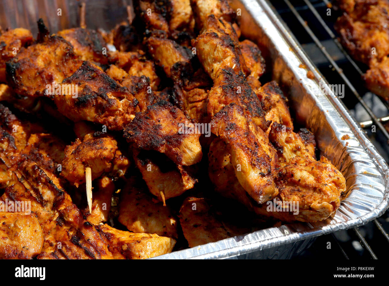 Chicken kebabs in a aluminum pan Stock Photo - Alamy