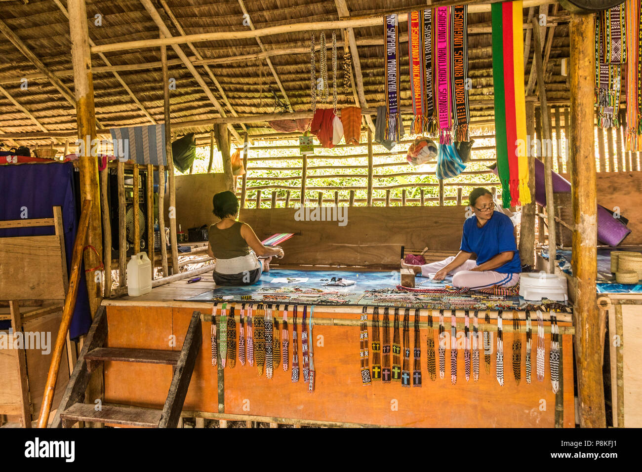 Ladies working on arts and crafts in traditional rungus longhouse ...