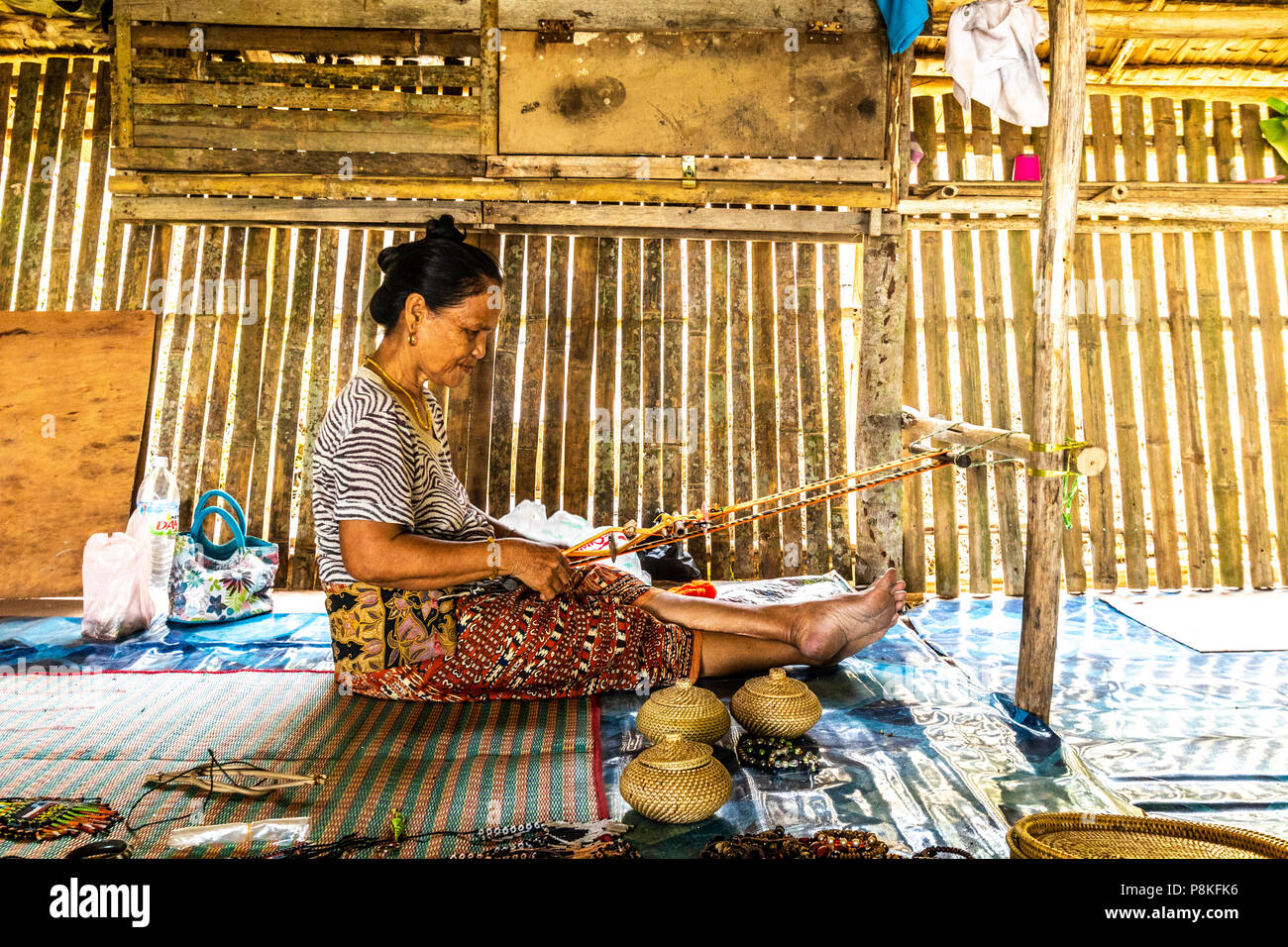Ladies working on arts and crafts in traditional rungus longhouse ...