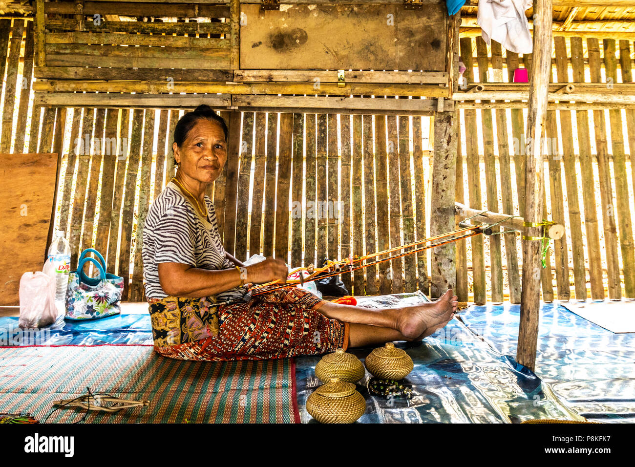 Ladies working on arts and crafts in traditional rungus longhouse ...