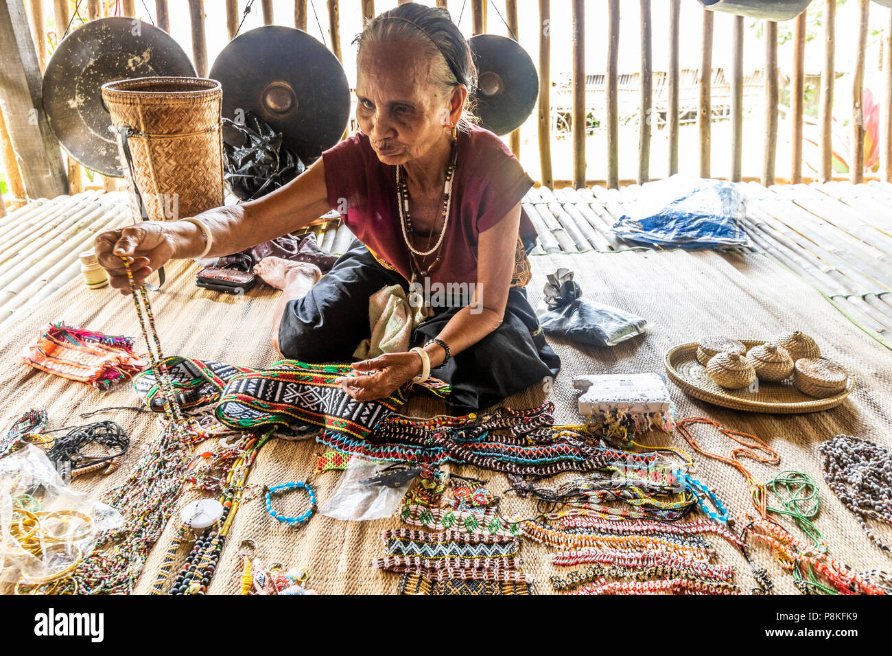Ladies working on arts and crafts in traditional rungus longhouse ...