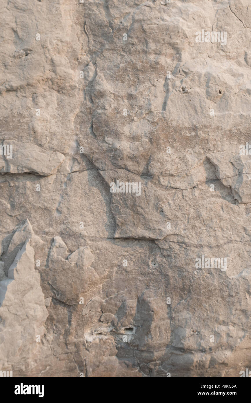 Closeup limestone rock face showing weathered strata and details for ...