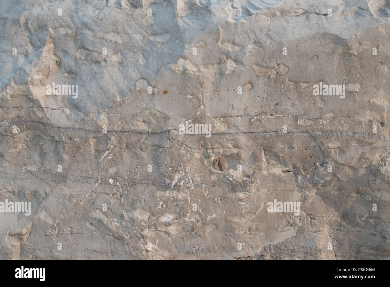 Closeup limestone rock face showing weathered strata and details for ...