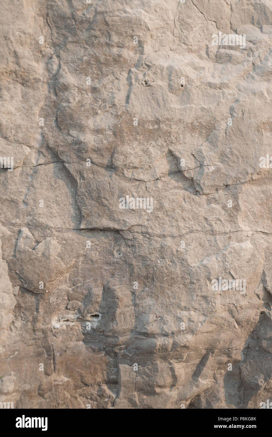 Closeup limestone rock face showing weathered strata and details for ...