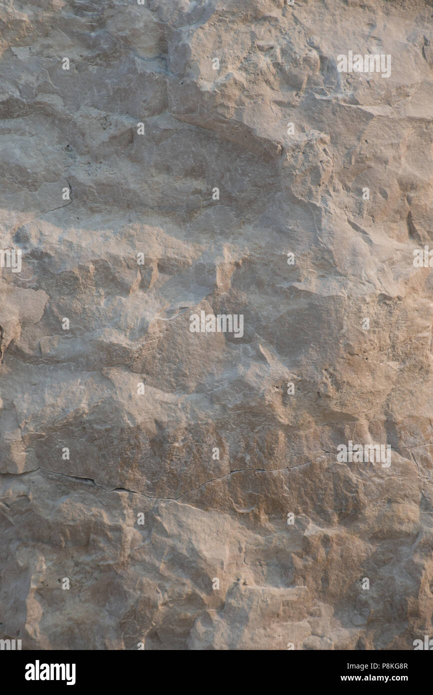 Closeup limestone rock face showing weathered strata and details for ...