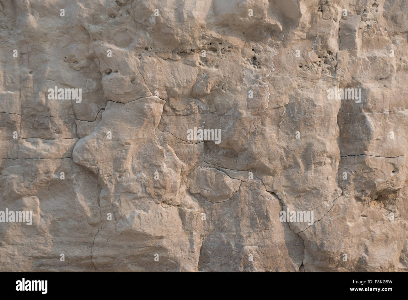 Closeup limestone rock face showing weathered strata and details for ...