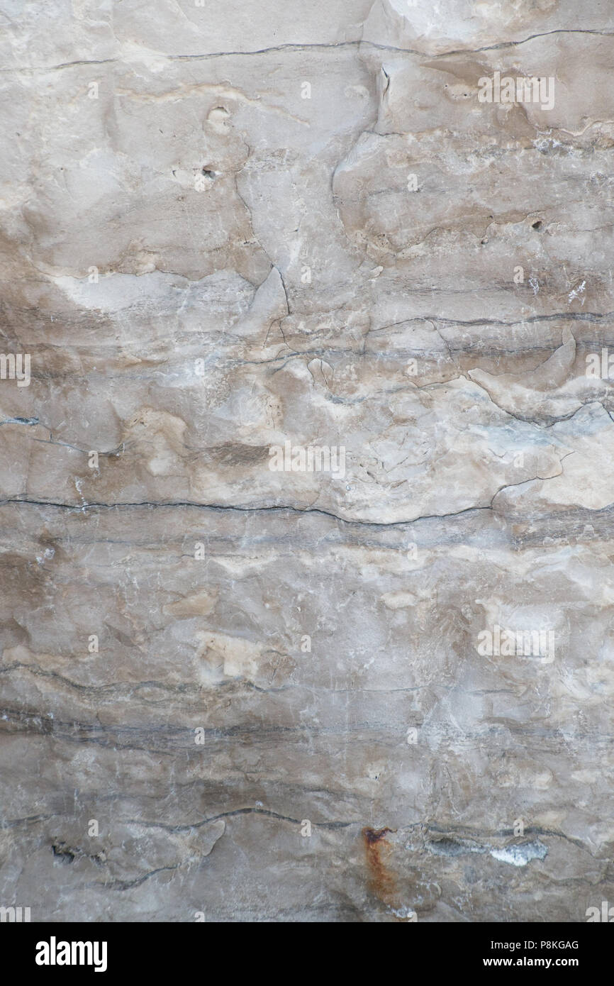 Closeup limestone rock face showing weathered strata and details for ...
