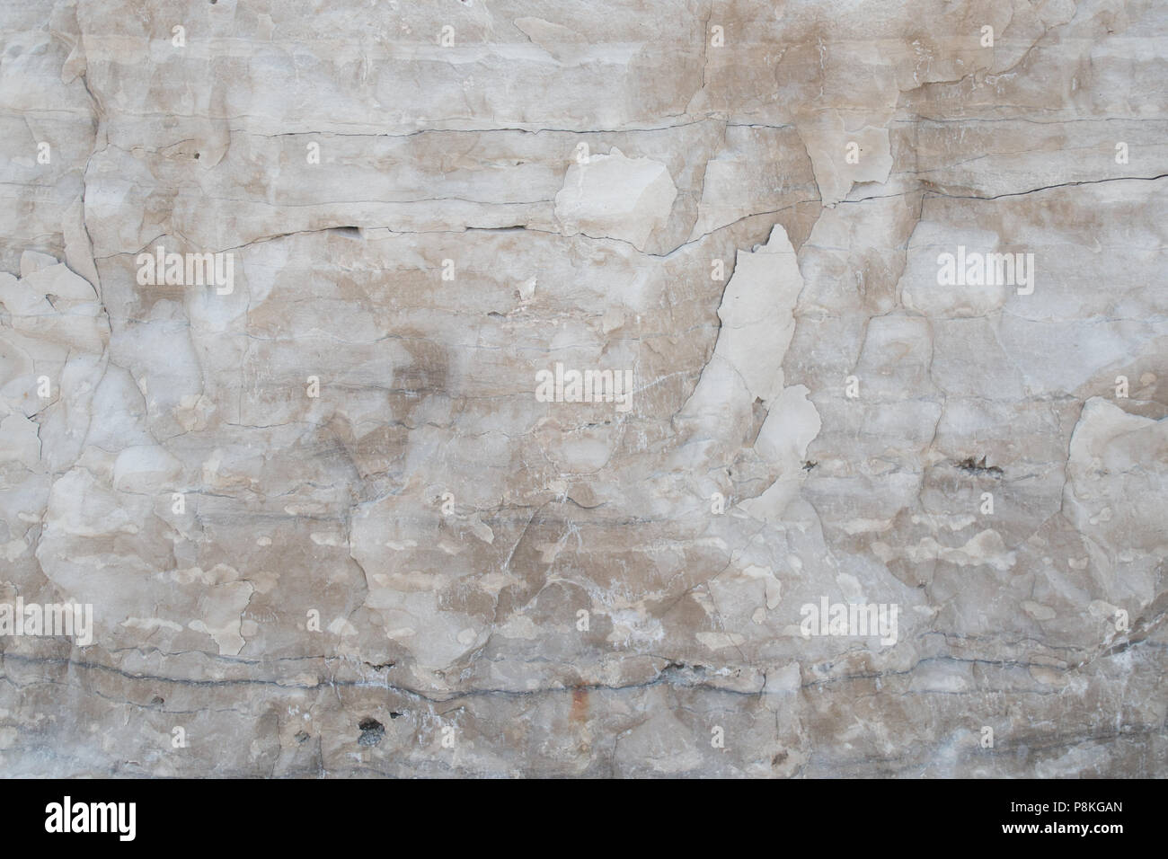 Closeup limestone rock face showing weathered strata and details for ...