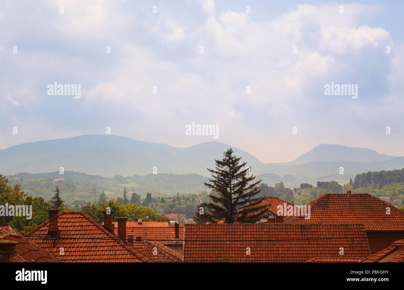 Cloudy day during summer, nature and houses, Balkan village countryside ...