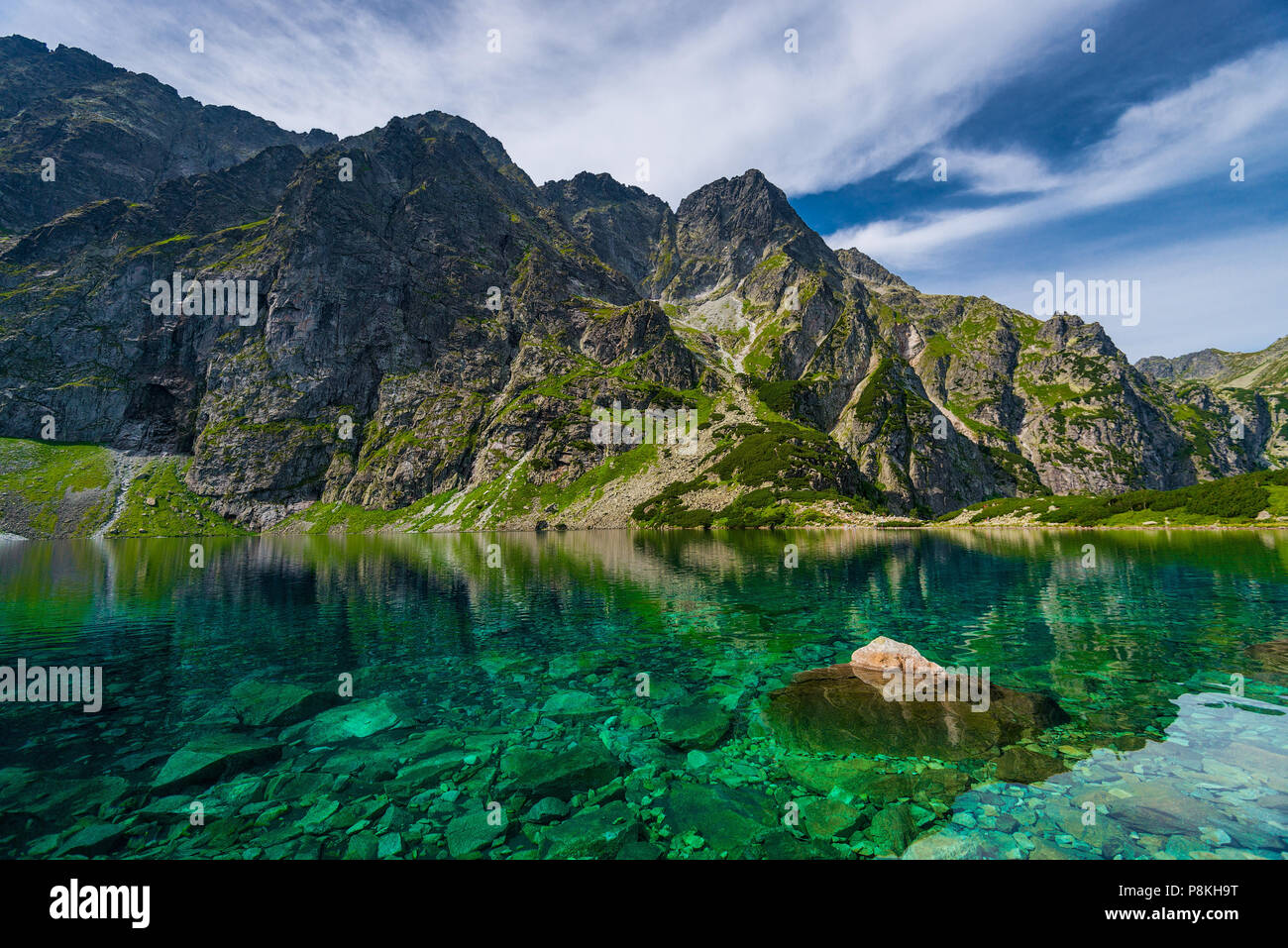 High Tatra mountains and picturesque clear lake Czarny Staw Stock Photo ...