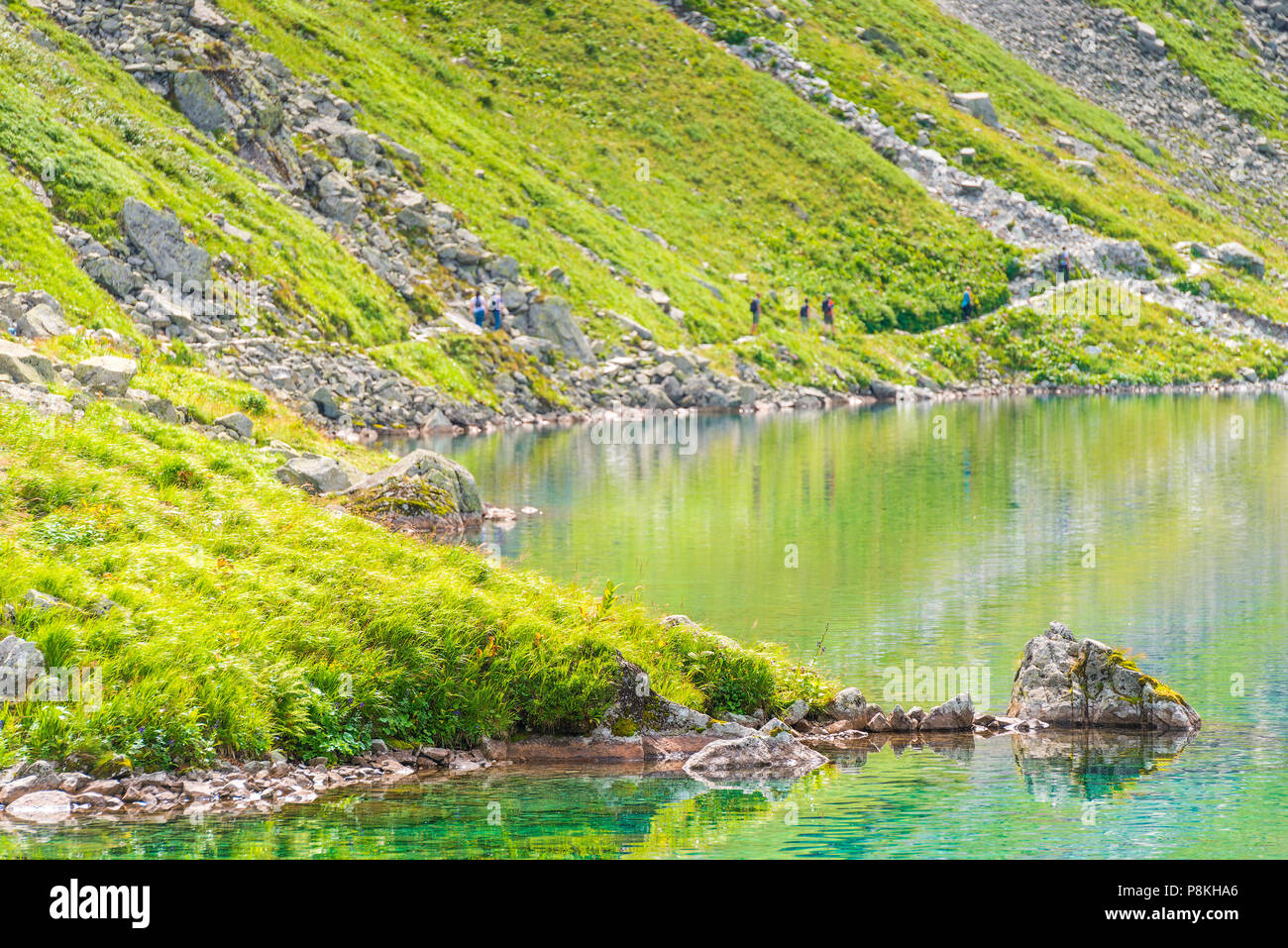 Slope of the mountain and part of the mountain lake close up Stock ...