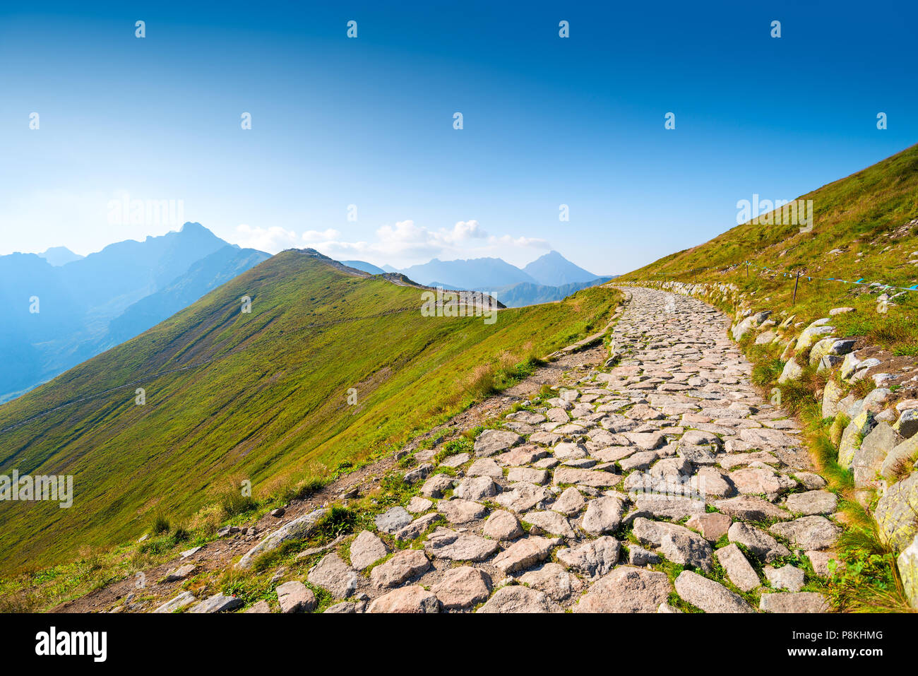 trail at the top of the mountain Kasprowy Up in Poland on a sunny day ...