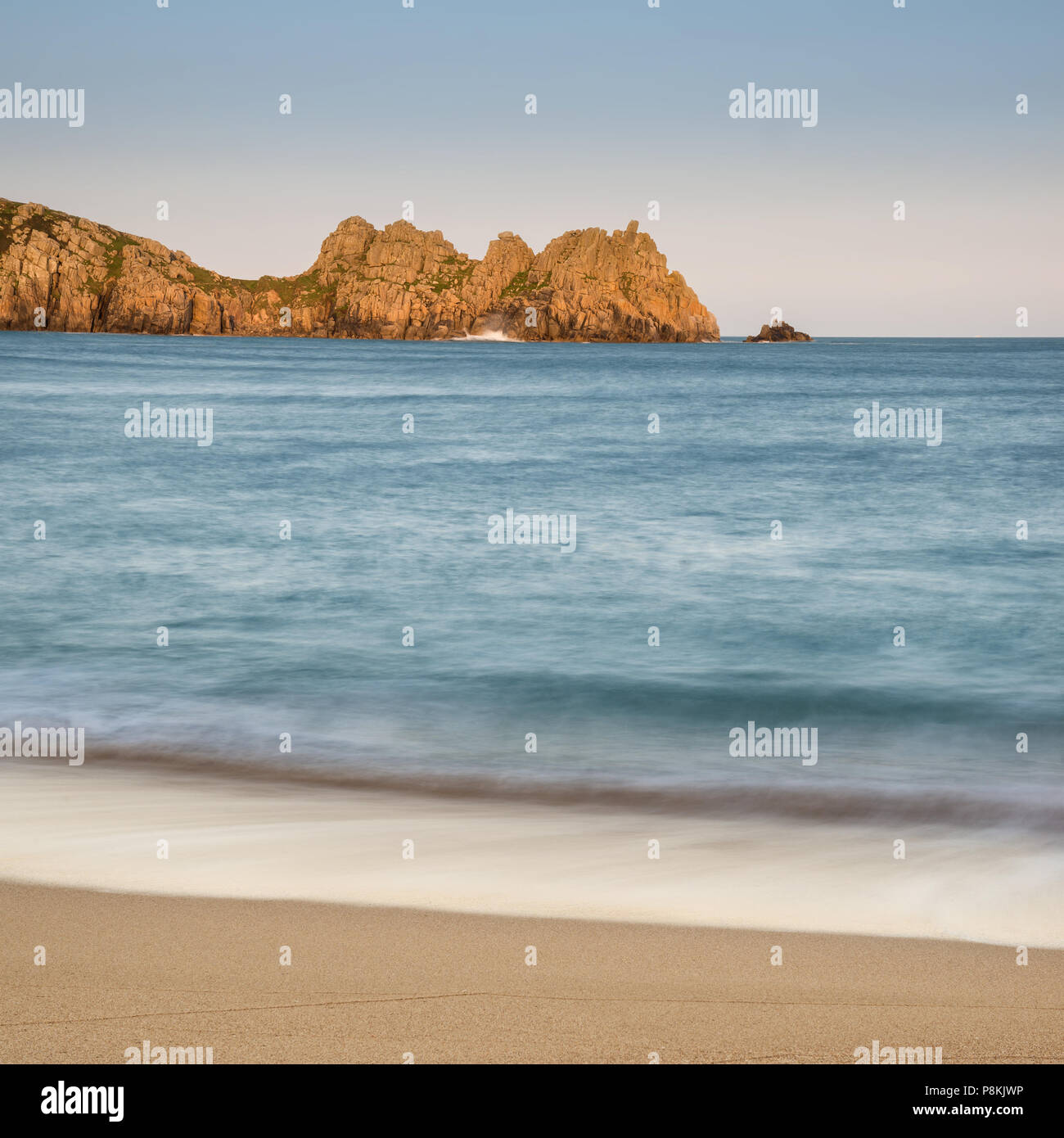 Beautiful sunset landscape image of Porthcurno beach on South Cornwall ...