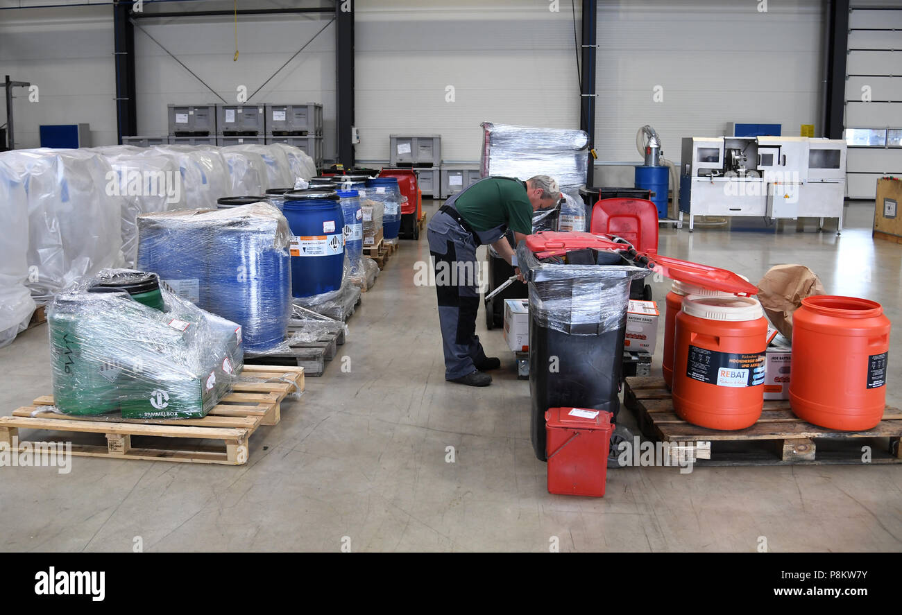 Krefeld, Germany. 12th July, 2018. Workers sort types of batteries in ...