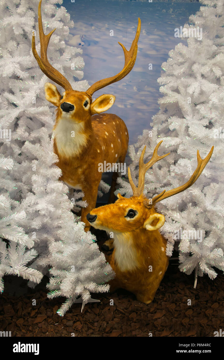 Two beautiful reindeer on white christmas tree Stock Photo - Alamy
