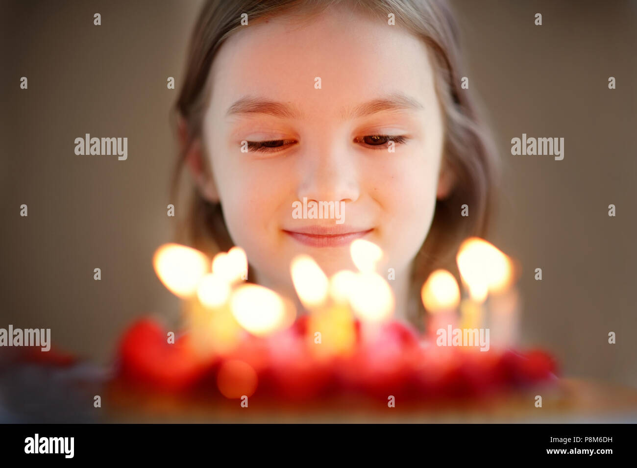 Adorable little girl and her delicious raspberry birthday cake Stock ...