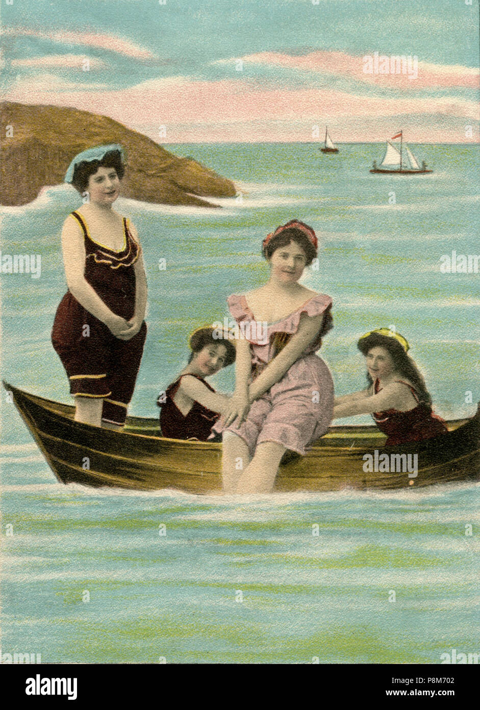 Young women in swimwear in boat Stock Photo - Alamy