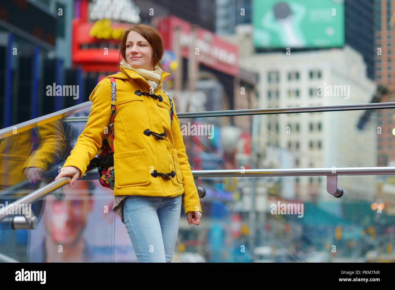 Beautiful young woman sightseeing at Times Square, New York Stock Photo ...
