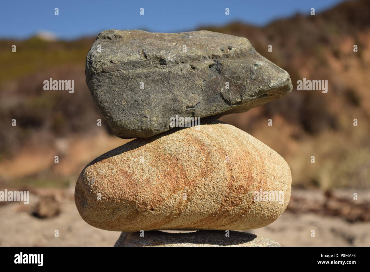Balancing rocks on the beach Stock Photo - Alamy