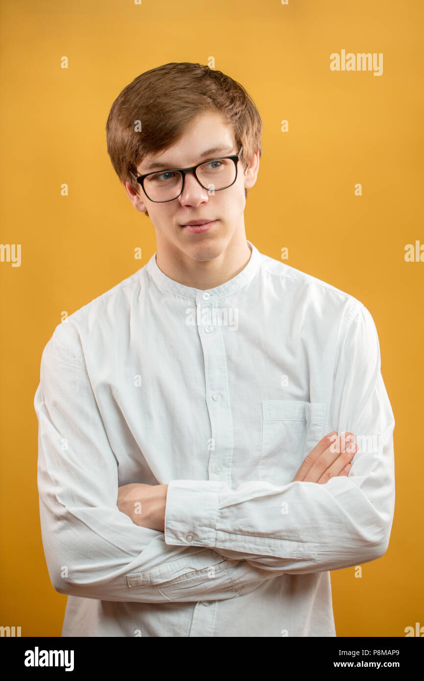 close up portrait of smirking male model in formal clothes with crossed ...