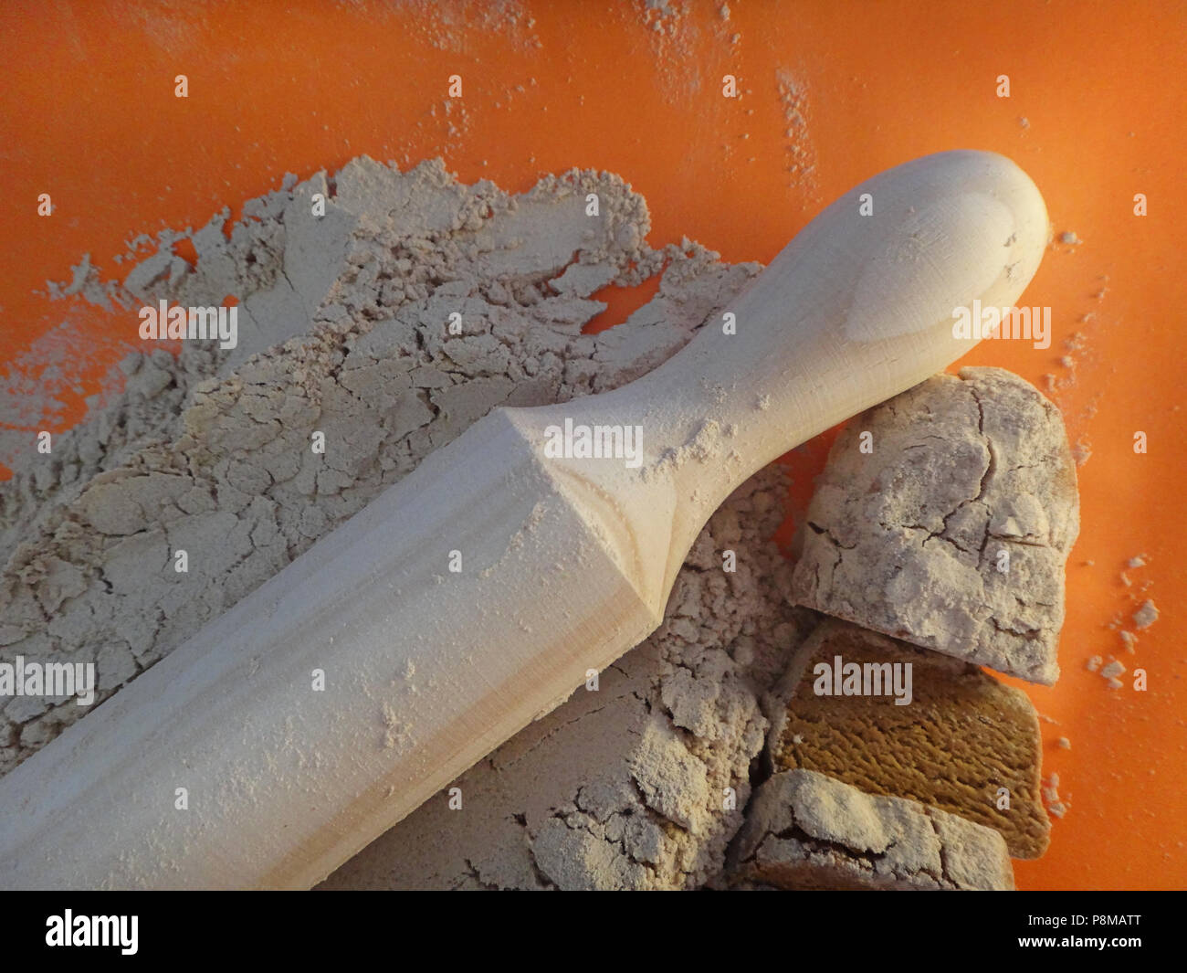 View from above of a pile of gofio flour, a rolling pin and slices of ...