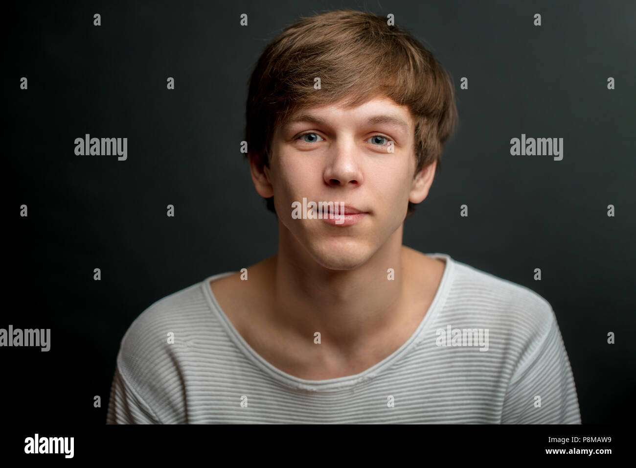 closeup portrait of handsome fair-haired guy with kind look isolated on ...