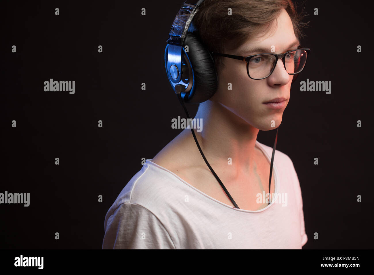close up side view shot of operator in white T-shirt isolated on the ...