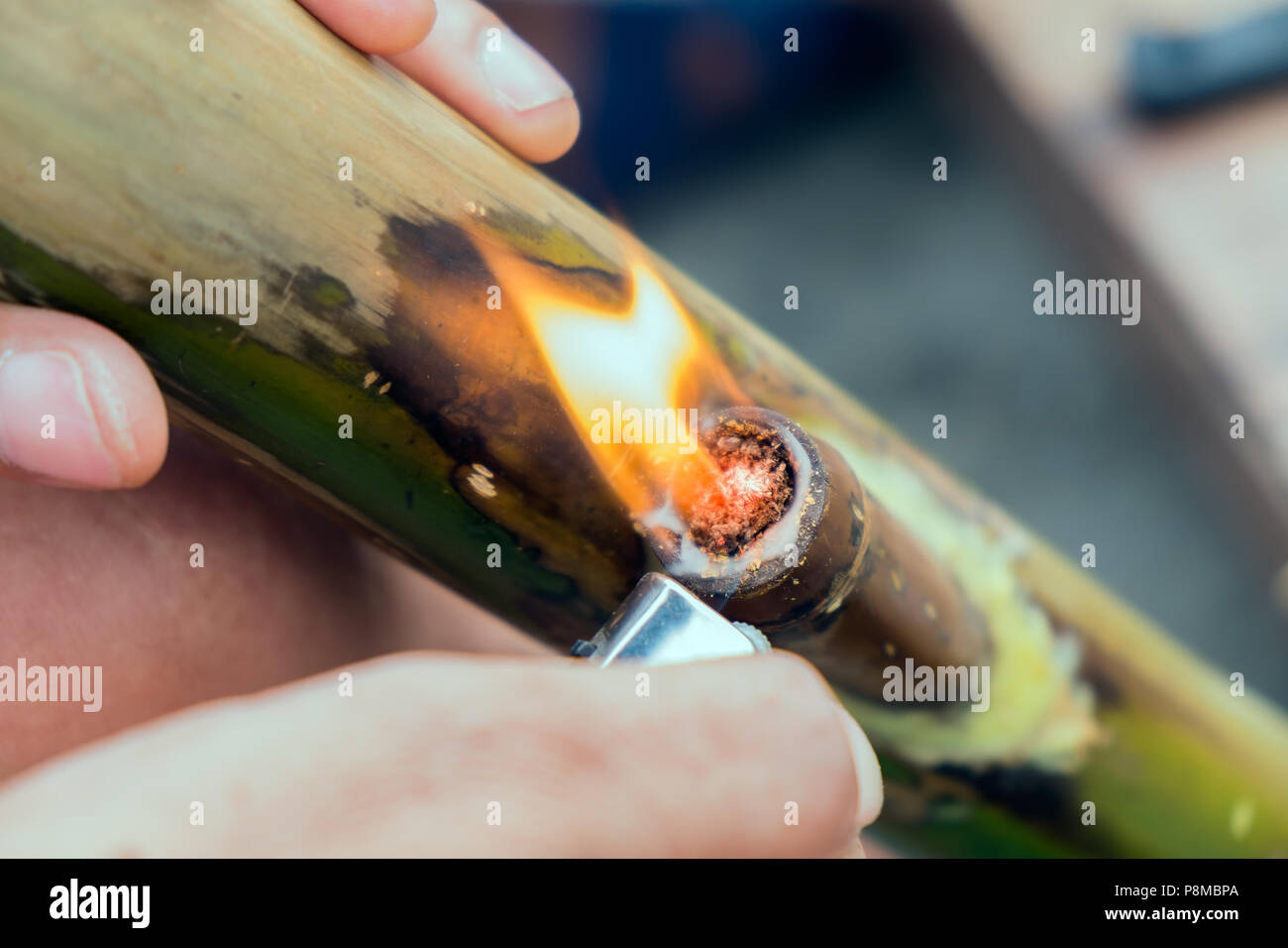 Closeup of smoking marijuana on bamboo pipe Stock Photo - Alamy