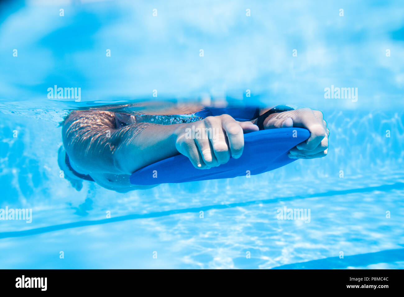 Person diving into swimming pool hi-res stock photography and images ...