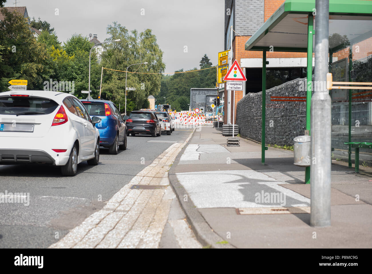 Construction site with single-lane traffic control and traffic light ...