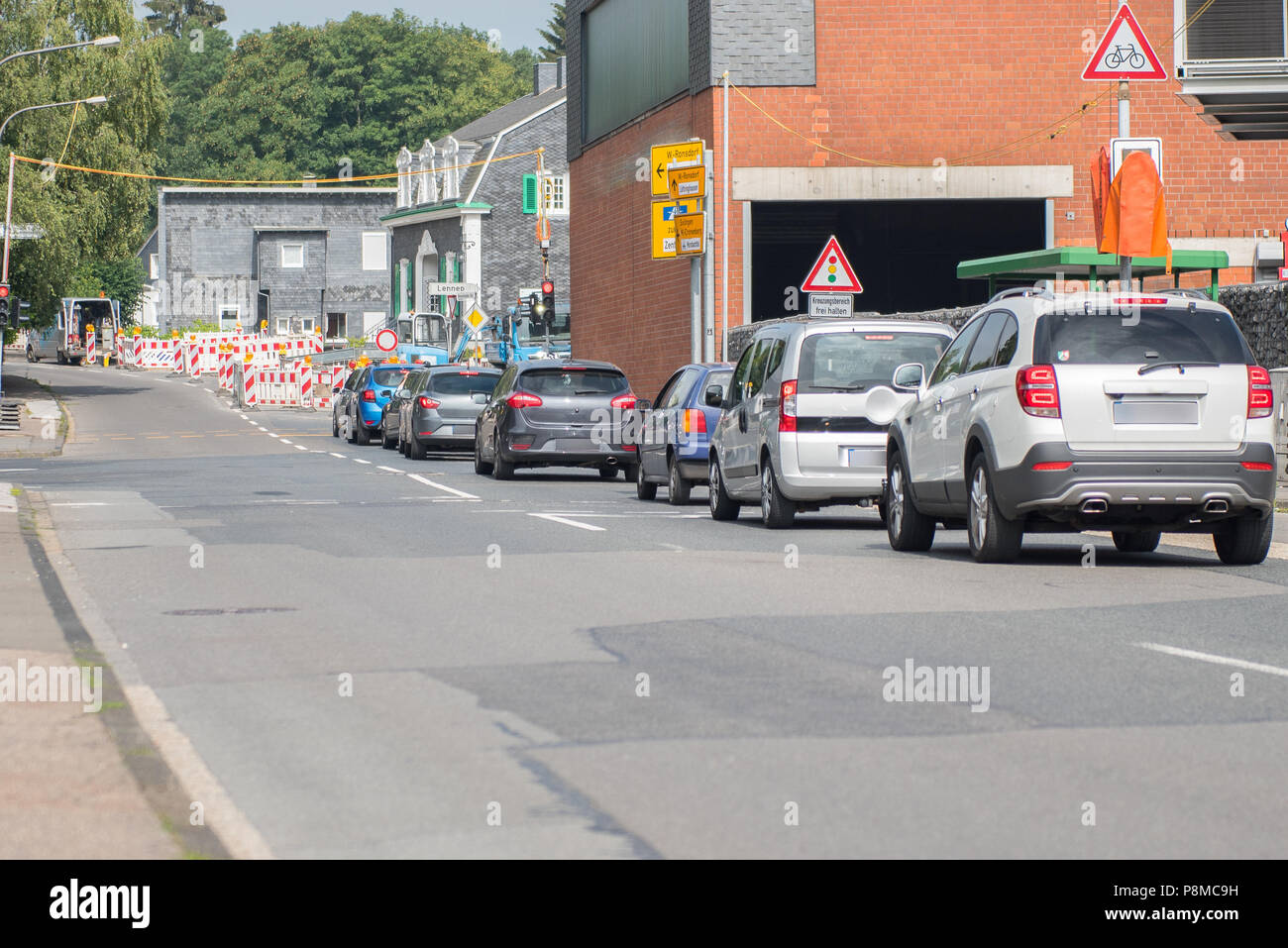 Construction site with single-lane traffic control and traffic light ...