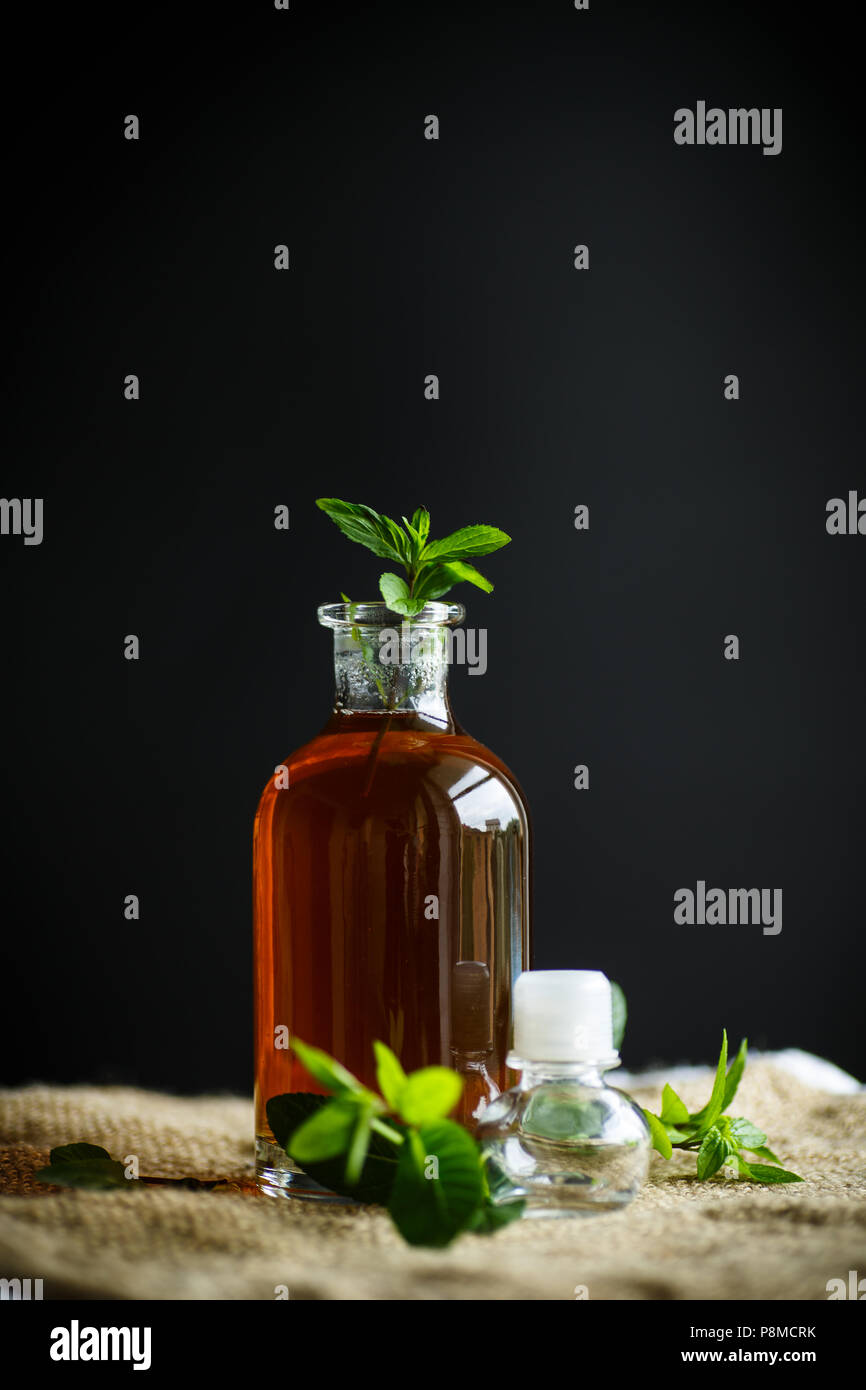Mint syrup in a glass bottle Stock Photo - Alamy