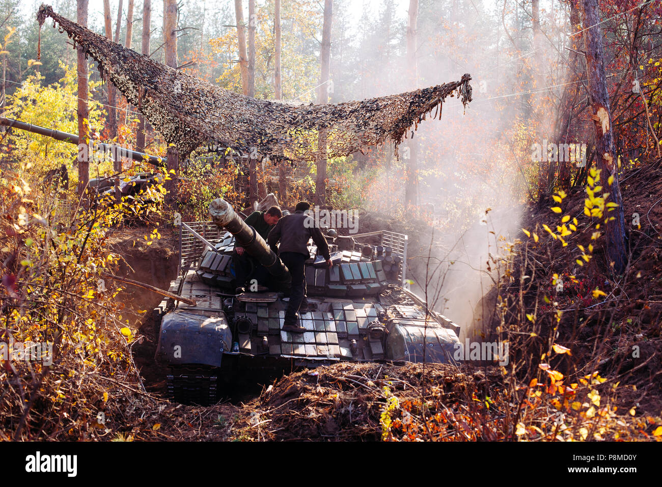 real battle tanks in motion along the unpaved forest road Ukraine Stock ...
