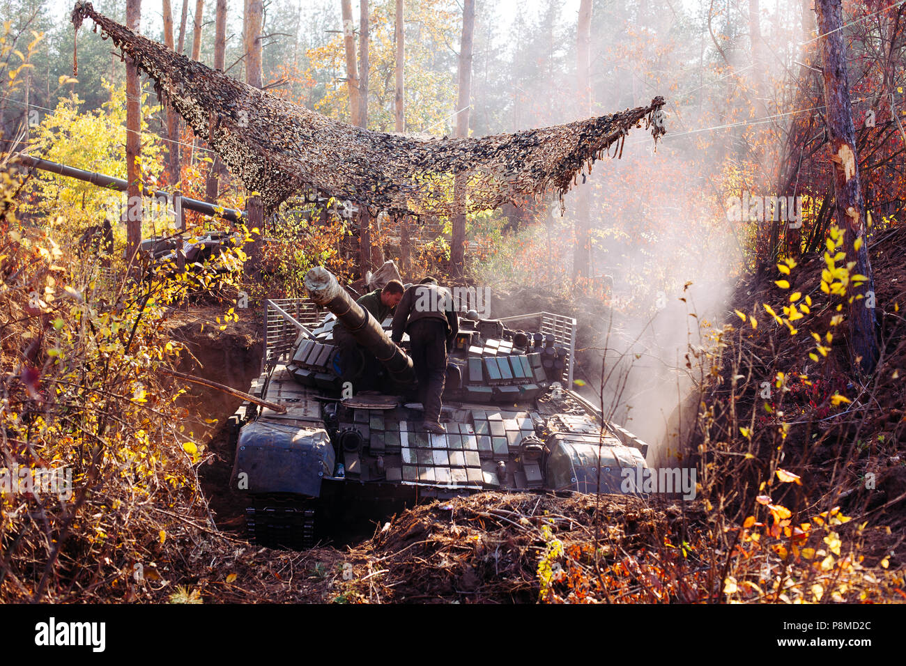 real battle tanks in motion along the unpaved forest road Ukraine Stock ...