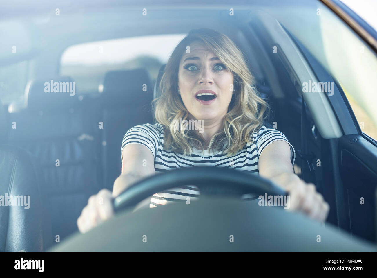 Angry woman driving car hi-res stock photography and images - Alamy