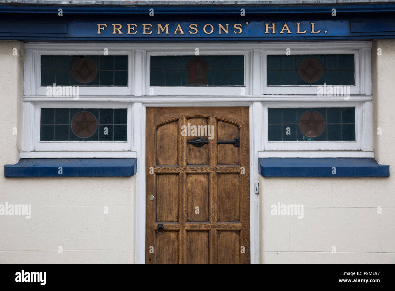 The facade and entrance of a Freemasons Hall or Lodge with large wooden ...