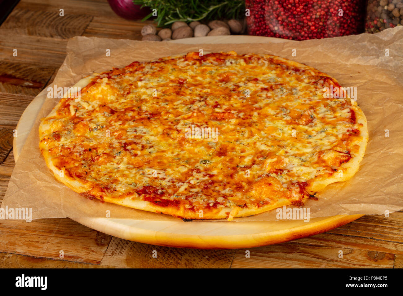 Delicious and big "4 cheese" pizza Stock Photo - Alamy