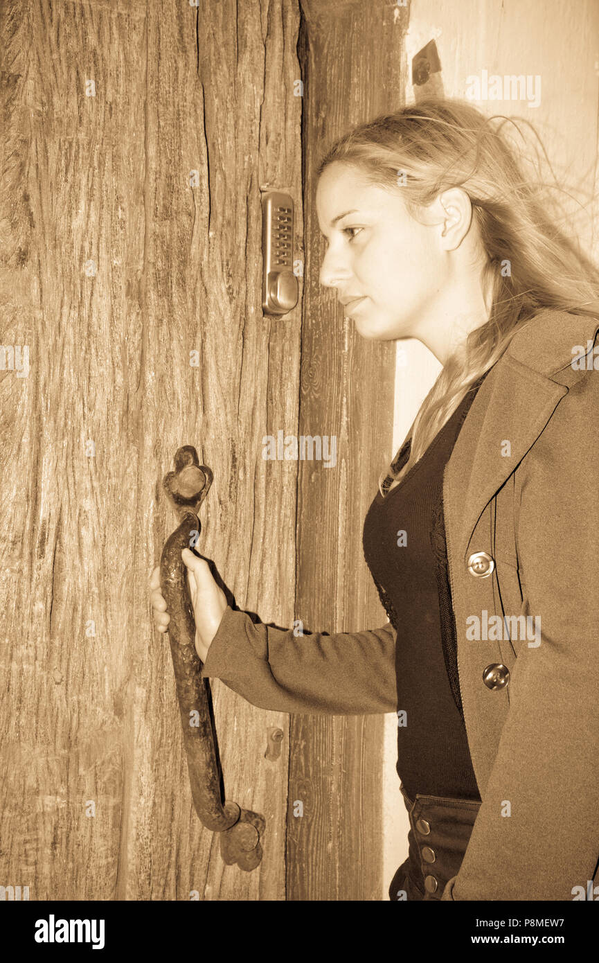 lady open heavy door Stock Photo - Alamy