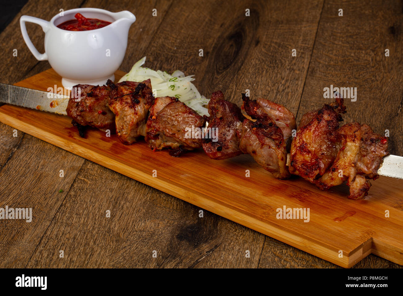 Grilled lamb kebab bbq with sauce and onion Stock Photo - Alamy
