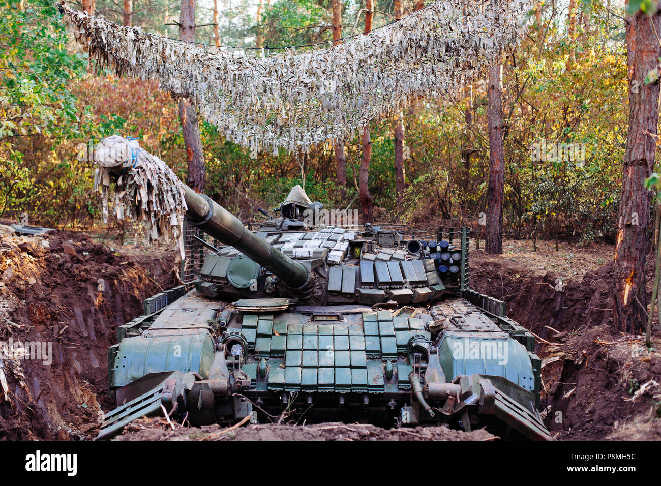 The tank from the hidden position is disguised in the trench Stock ...