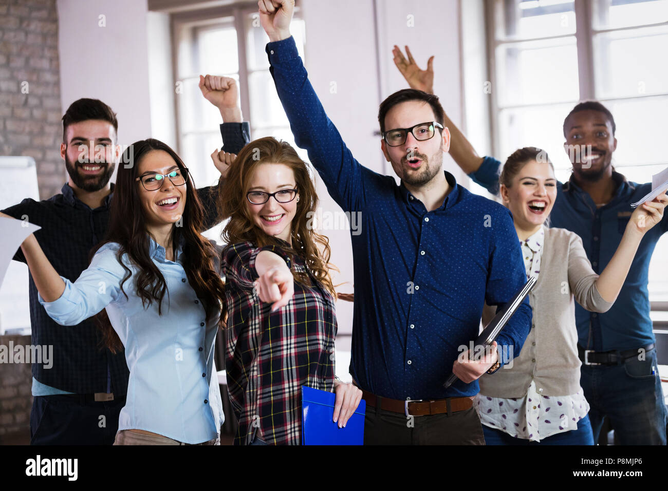 Team posing hi-res stock photography and images - Alamy