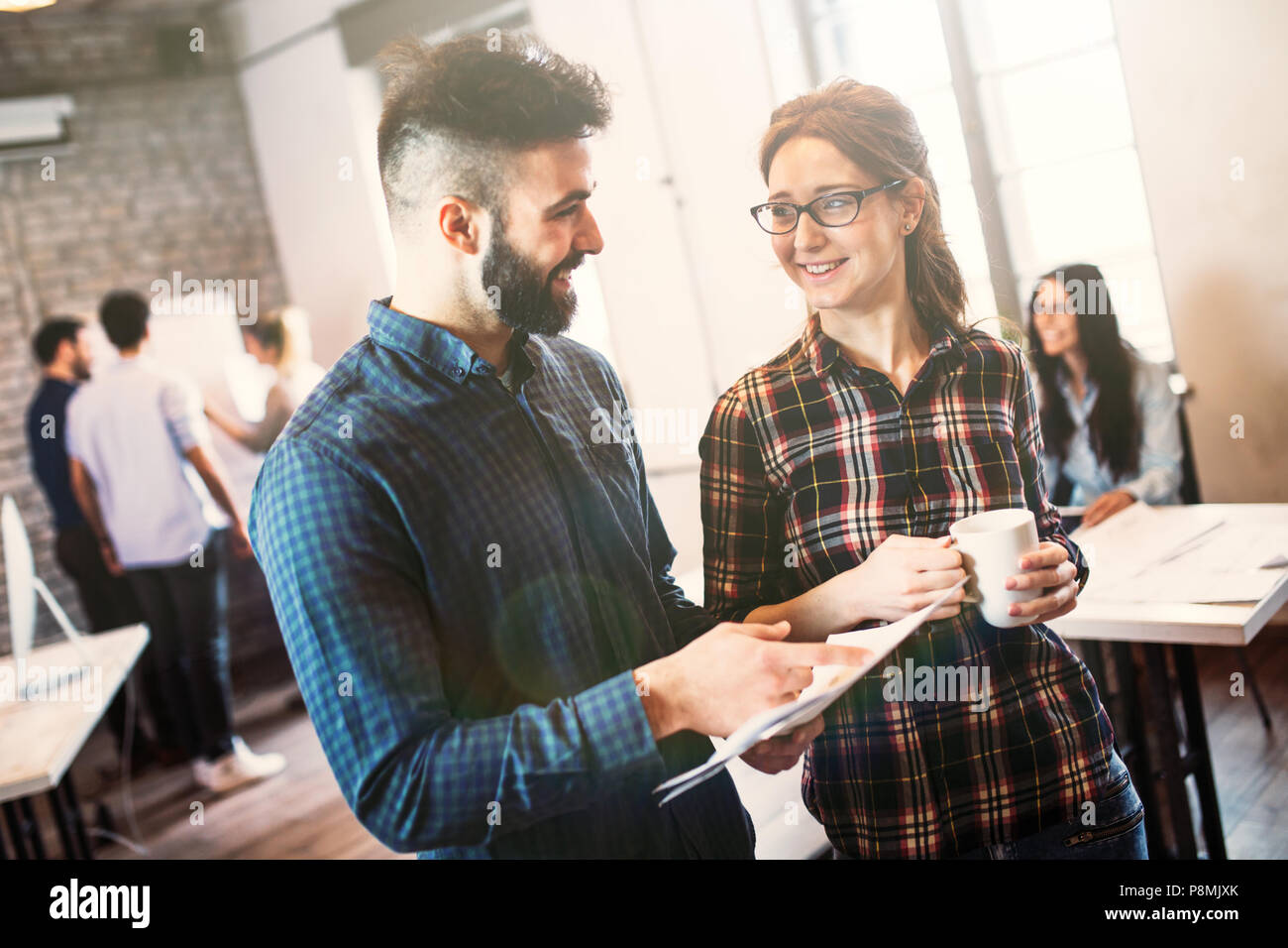 Team architects having conversation in hi-res stock photography and ...