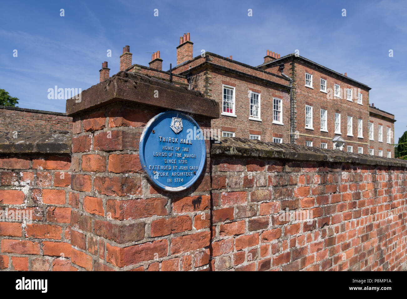 A blue plaque outside Thirsk Hall, in the market town of Thirsk, North ...
