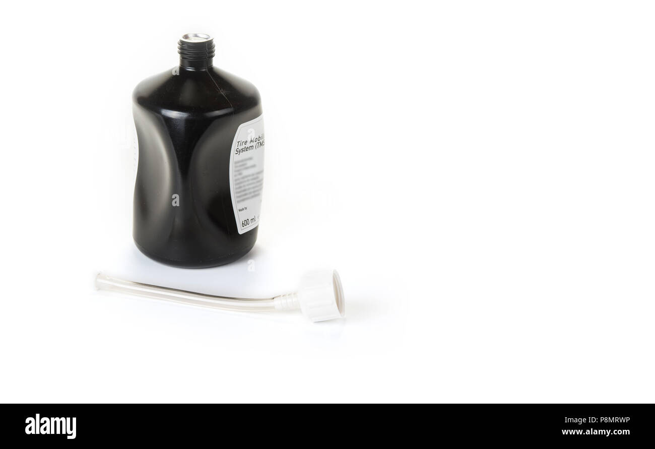 Quick fix of a car puncture kit on the white Stock Photo - Alamy