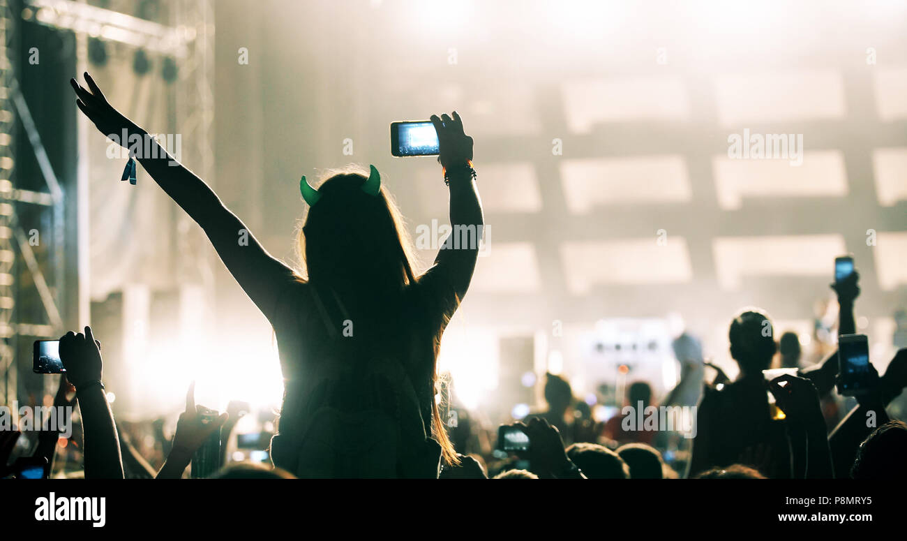 Cheering crowd at concert enjoying music performance Stock Photo - Alamy