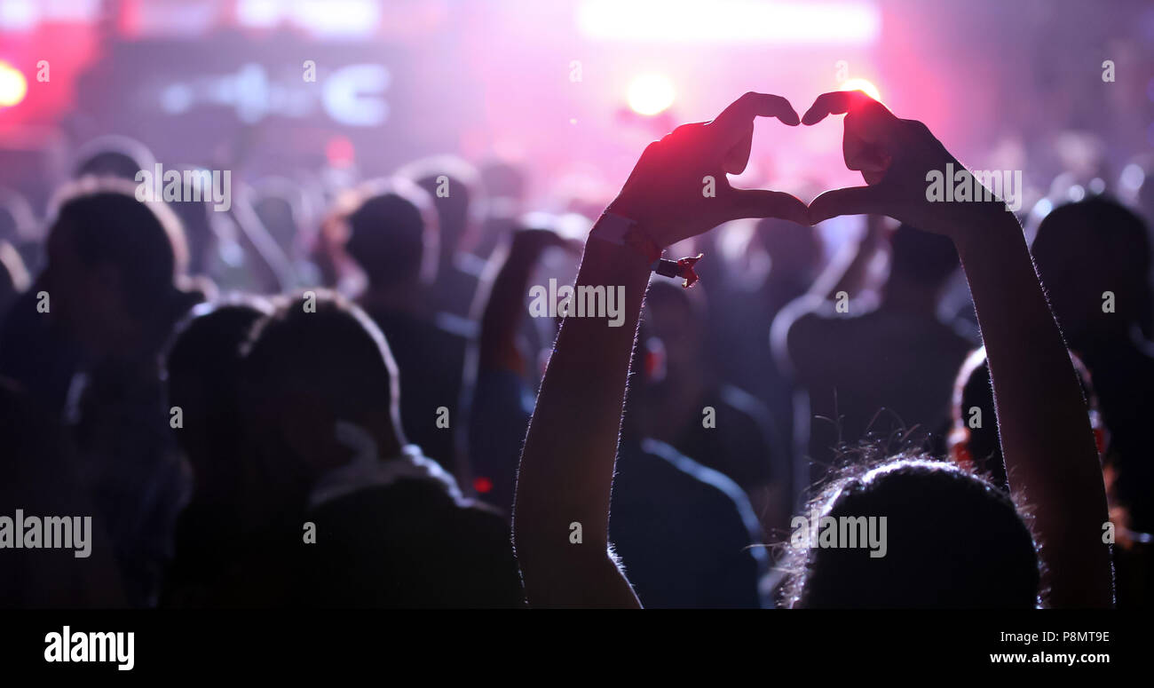 People dancing and cheering at festival Stock Photo - Alamy