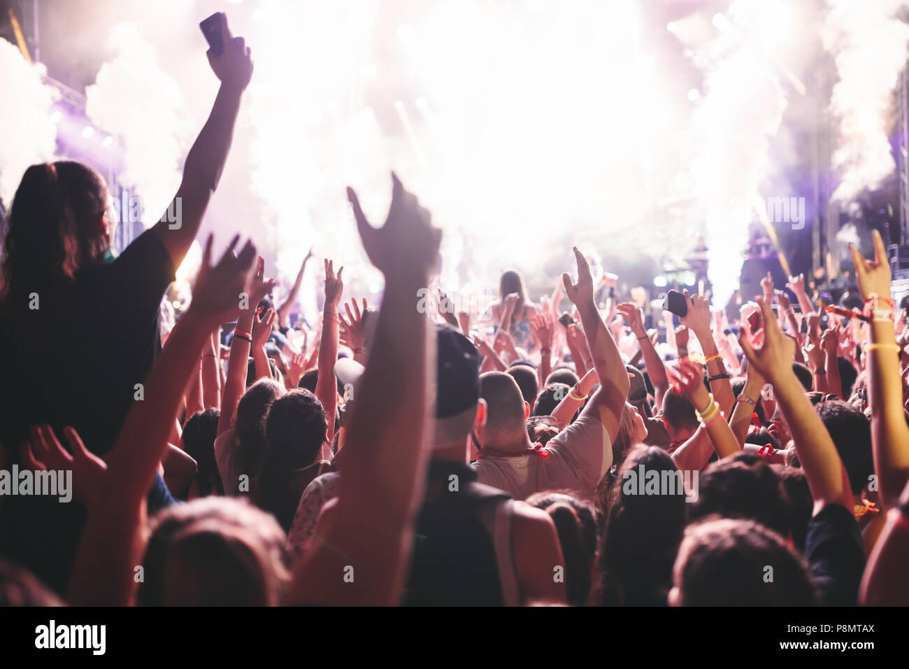 Portrait of happy crowd enjoying at music festival Stock Photo - Alamy