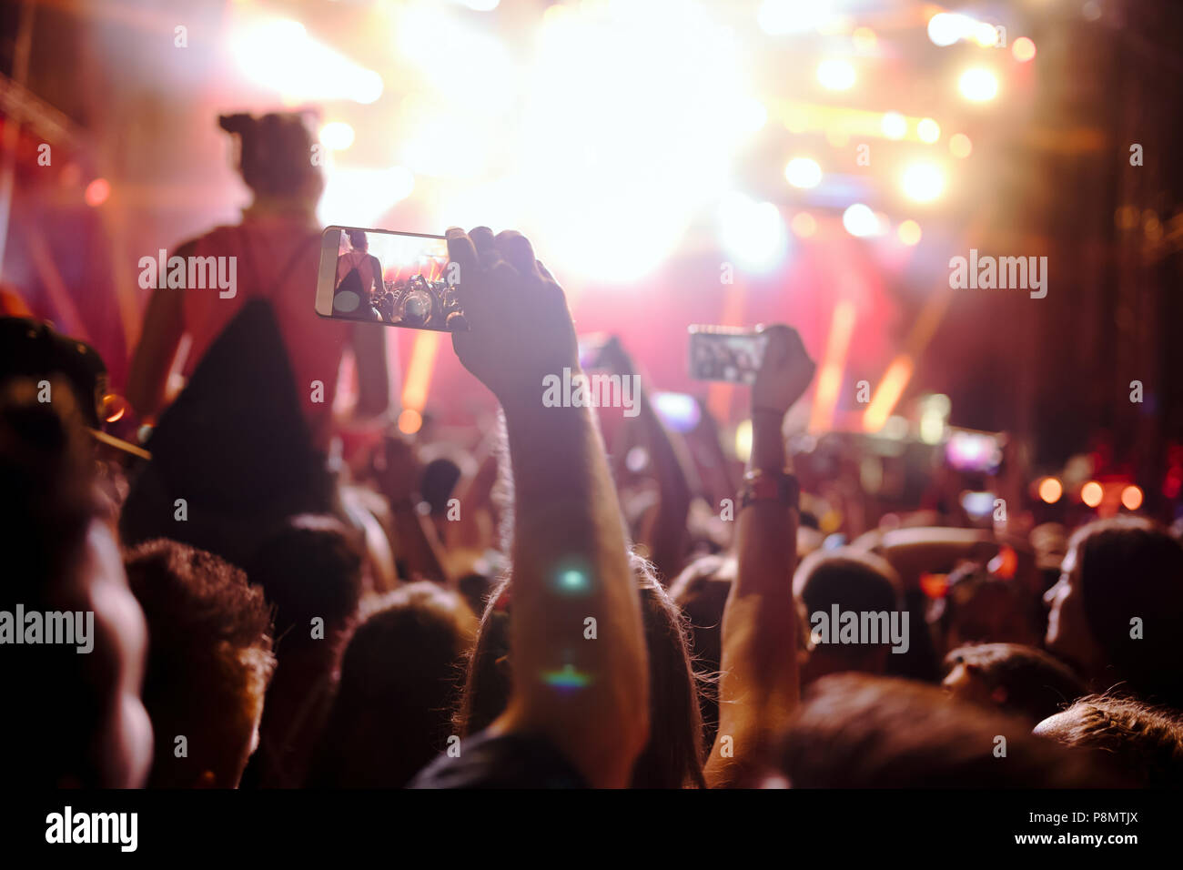 Portrait of happy crowd enjoying at music festival Stock Photo - Alamy
