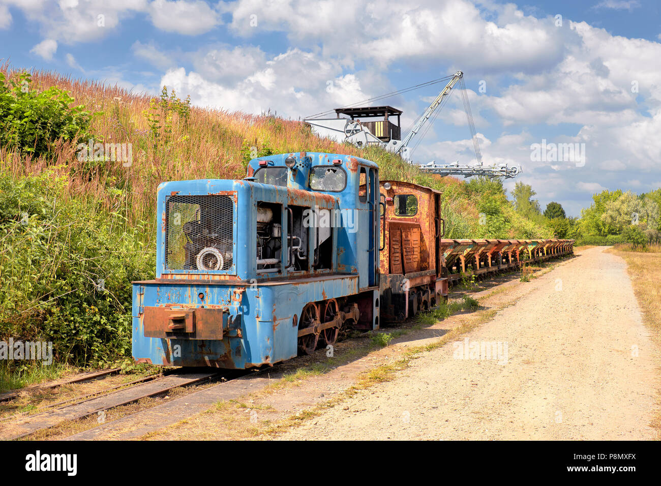 Old historical diesel locomotive and cargo carts outdoors Stock Photo ...