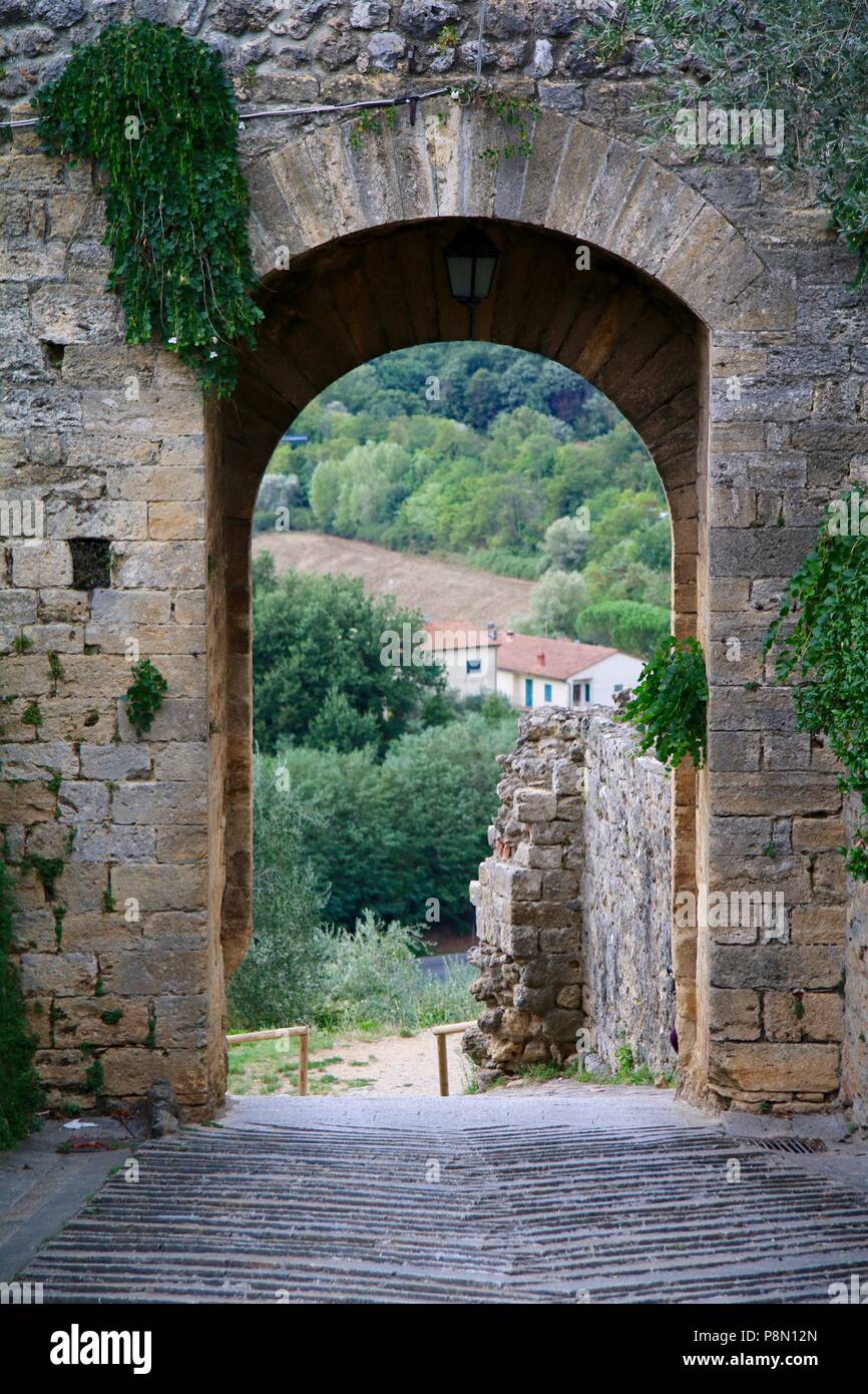 A stone archway with Italian countryside in the background Stock Photo ...